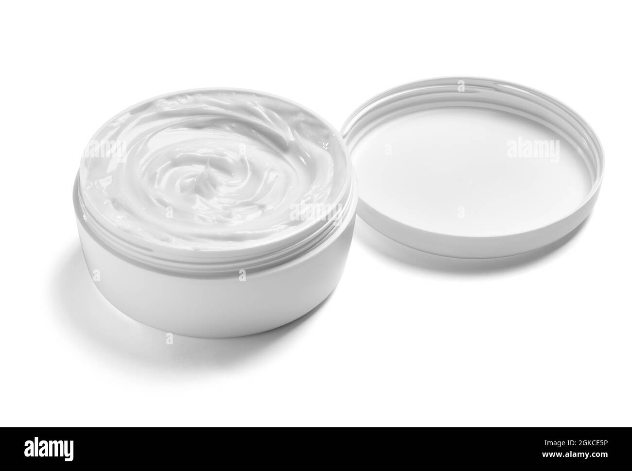 close up of a white beauty cream in a container on white background ...