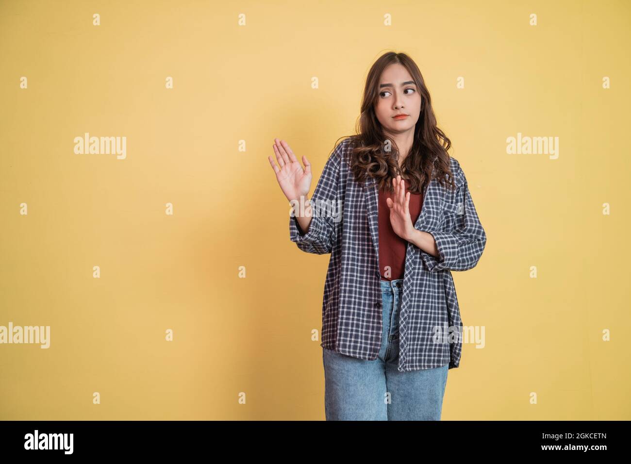 beautiful woman with hand gesture pose rejecting offer with copyspace ...