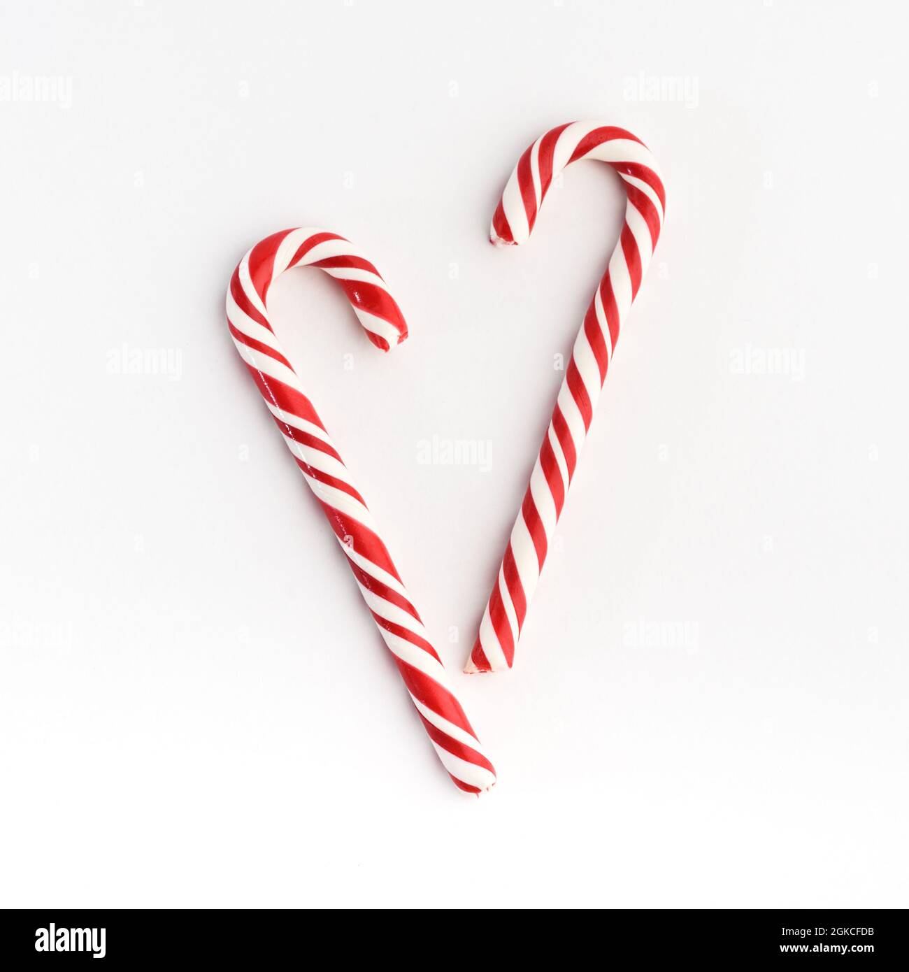 Christmas striped red and white heart shaped hard candies on white ...