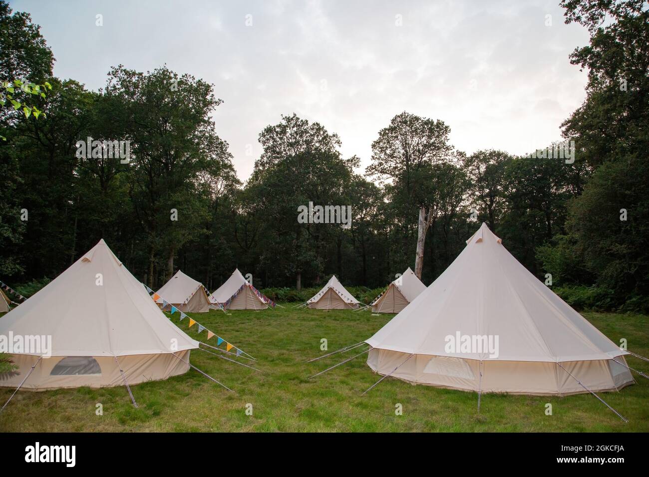 Glamping teepees in a circle in a field Stock Photo - Alamy
