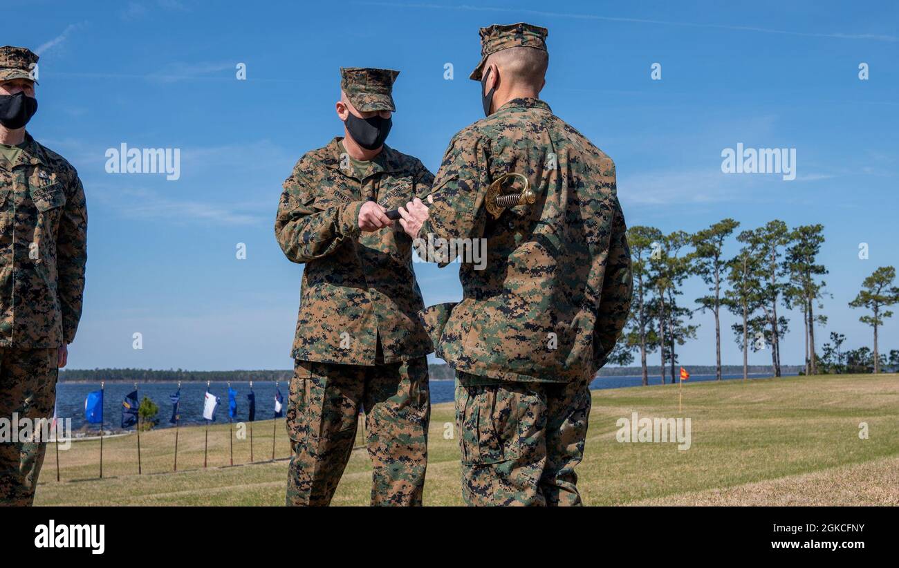 U.S. Marine Corps Sgt. Maj. Jason K. Jones, passes the sword to Col ...