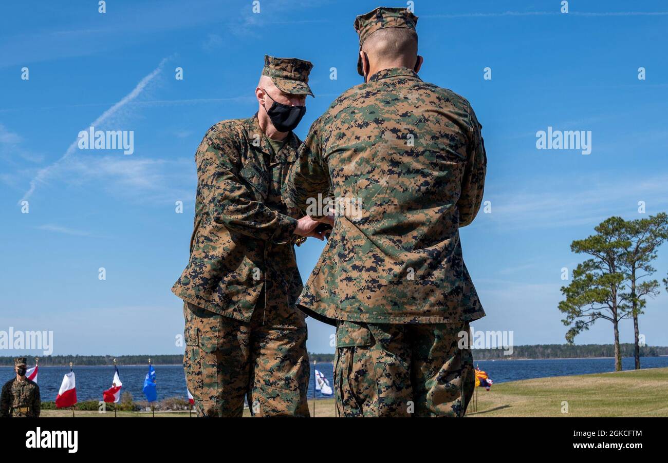 U.S. Marine Corps Sgt. Maj. William J. Gwaltney receives the sword from ...