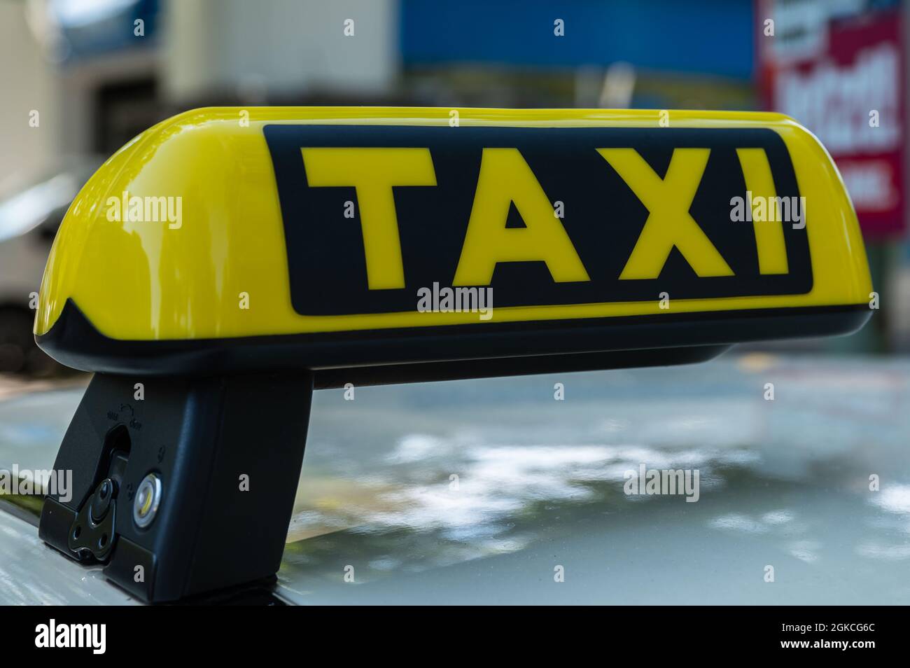 Taxi sign on a German taxi taken from the left Stock Photo - Alamy