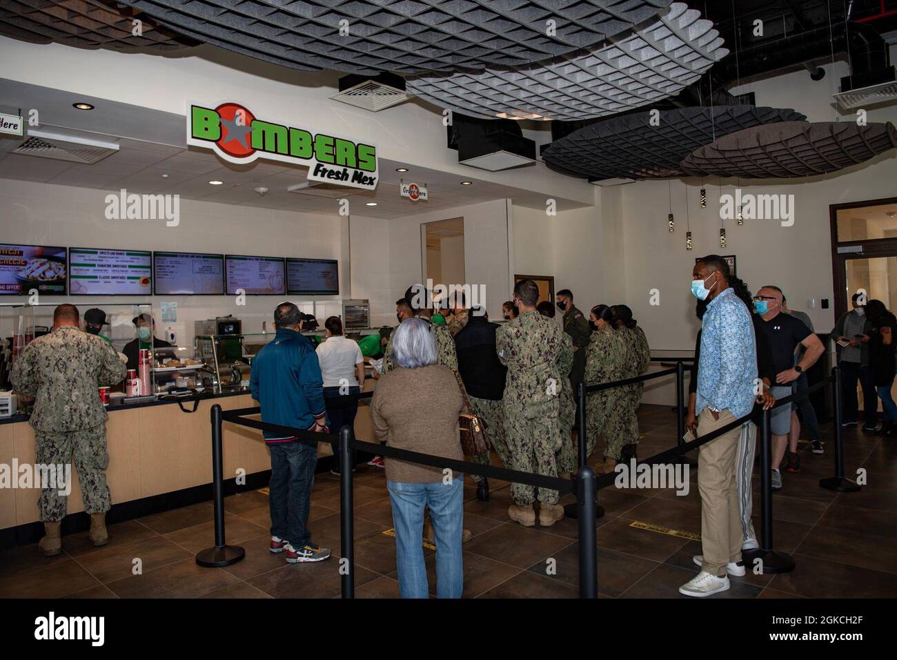 NAVAL STATION ROTA, Spain (Mar. 12, 2021) - A group of customers wait ...