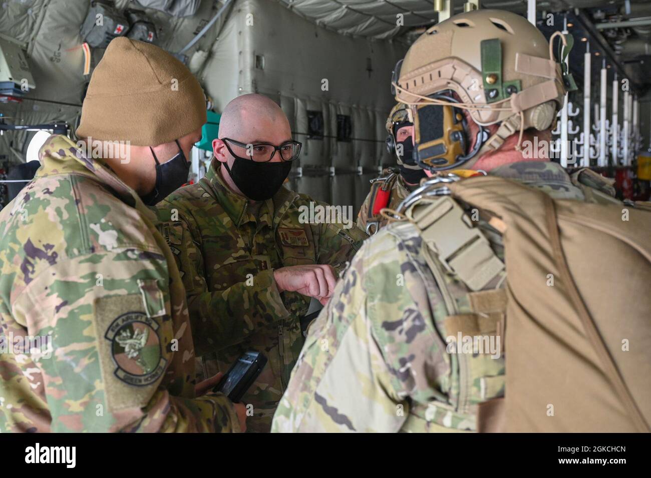 Capt. Riley Miller, 61st Airlift Squadron pilot, briefs Utah National ...
