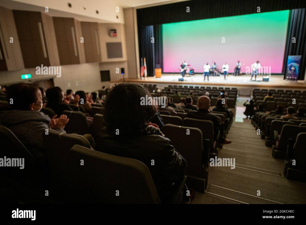 Japanese audience members watch the Air Force Band of the Pacific's ...