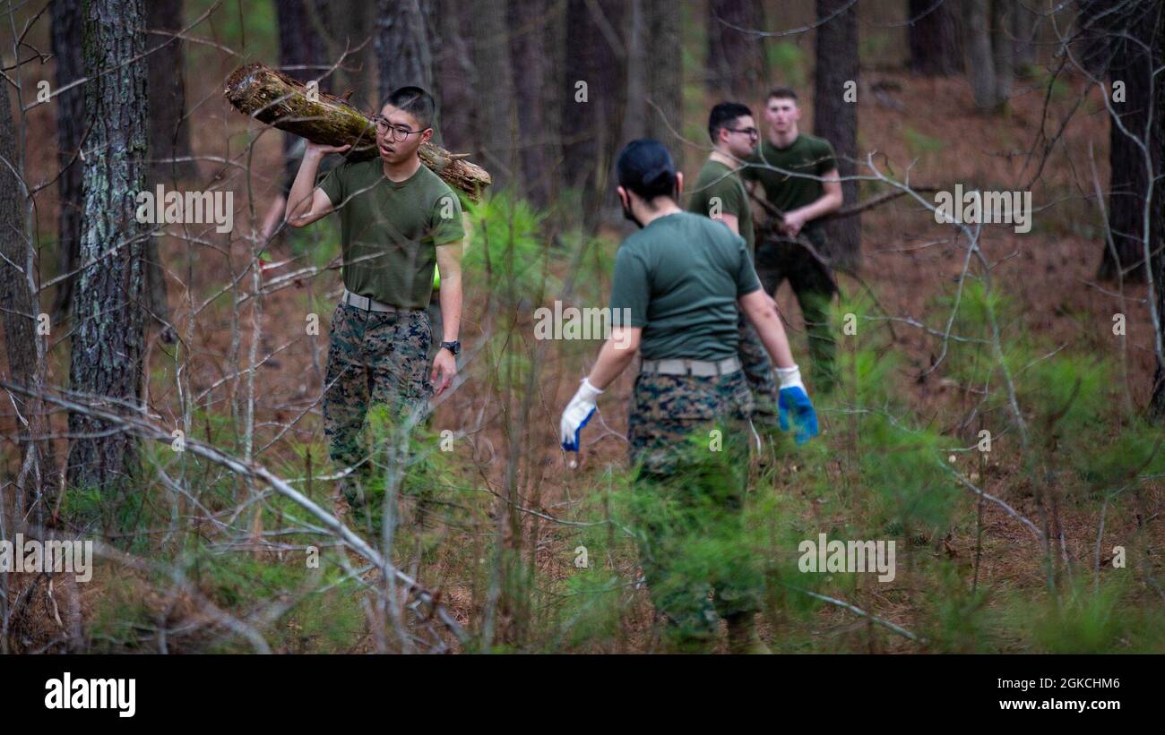 U.S. Marines with Marine Corps Base Quantico, help conduct a cleanup at ...