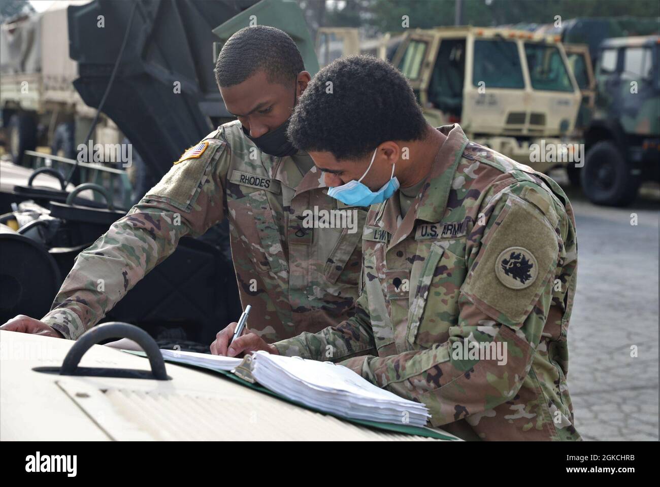 U.S. Army Spc. Joseph Lewis (right) and Pfc. Joshua Rhodes (left), both ...