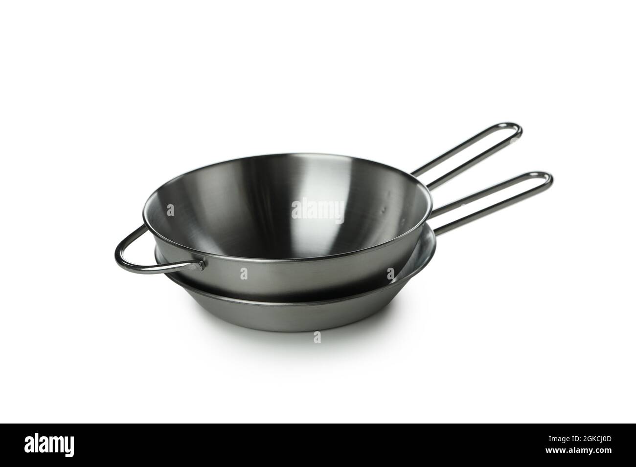 Metal pan with saucepan isolated on white background Stock Photo - Alamy