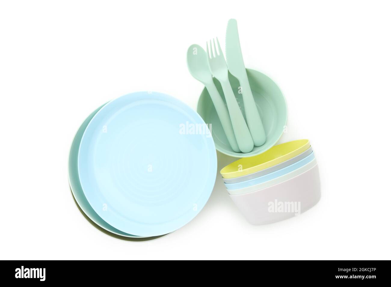 Colorful plastic dishware isolated on white background Stock Photo - Alamy
