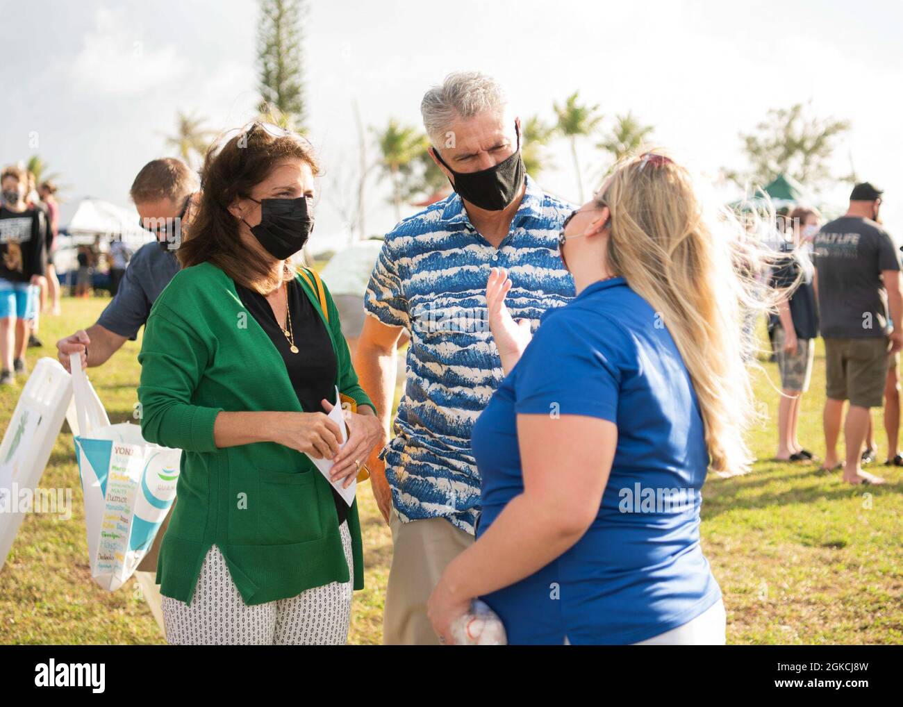 A volunteer speaks with Brig. Gen. Jeremy Sloane, commander of the 36th ...