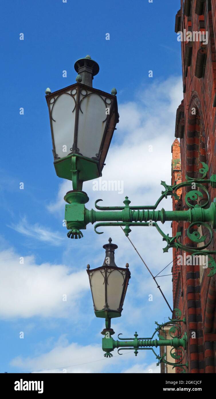 imposing ornate green street lights against the backdrop of blue sky ...