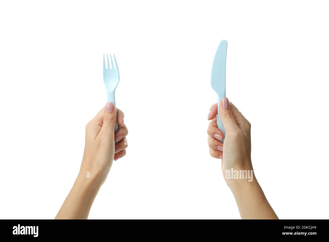 Female hands hold cutlery, isolated on white background Stock Photo - Alamy