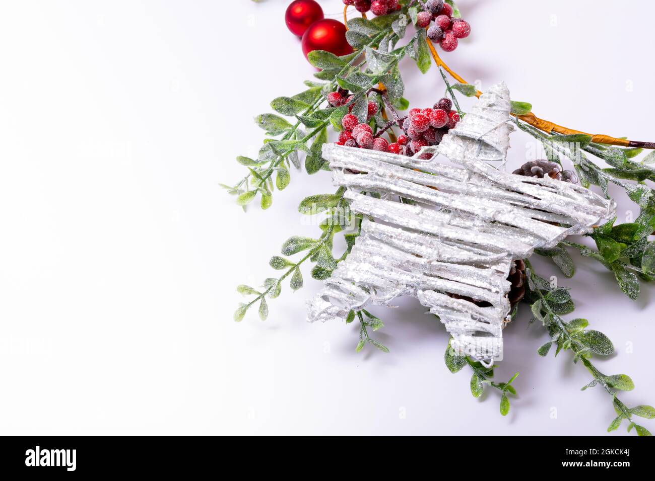 Composition of christmas decorations with star, branches and copy space ...