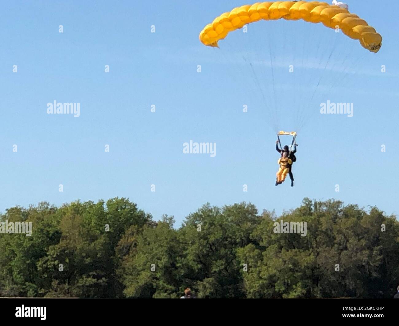 Sandee Rouse and Army Sgt. Maj. Jose Vazquez, Special Operations Command Para-Commando, prepare ...