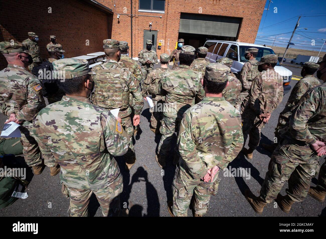 U.S. Army Sgt. Shavon A. Whyte, center front, blue mask, Hotel Company ...