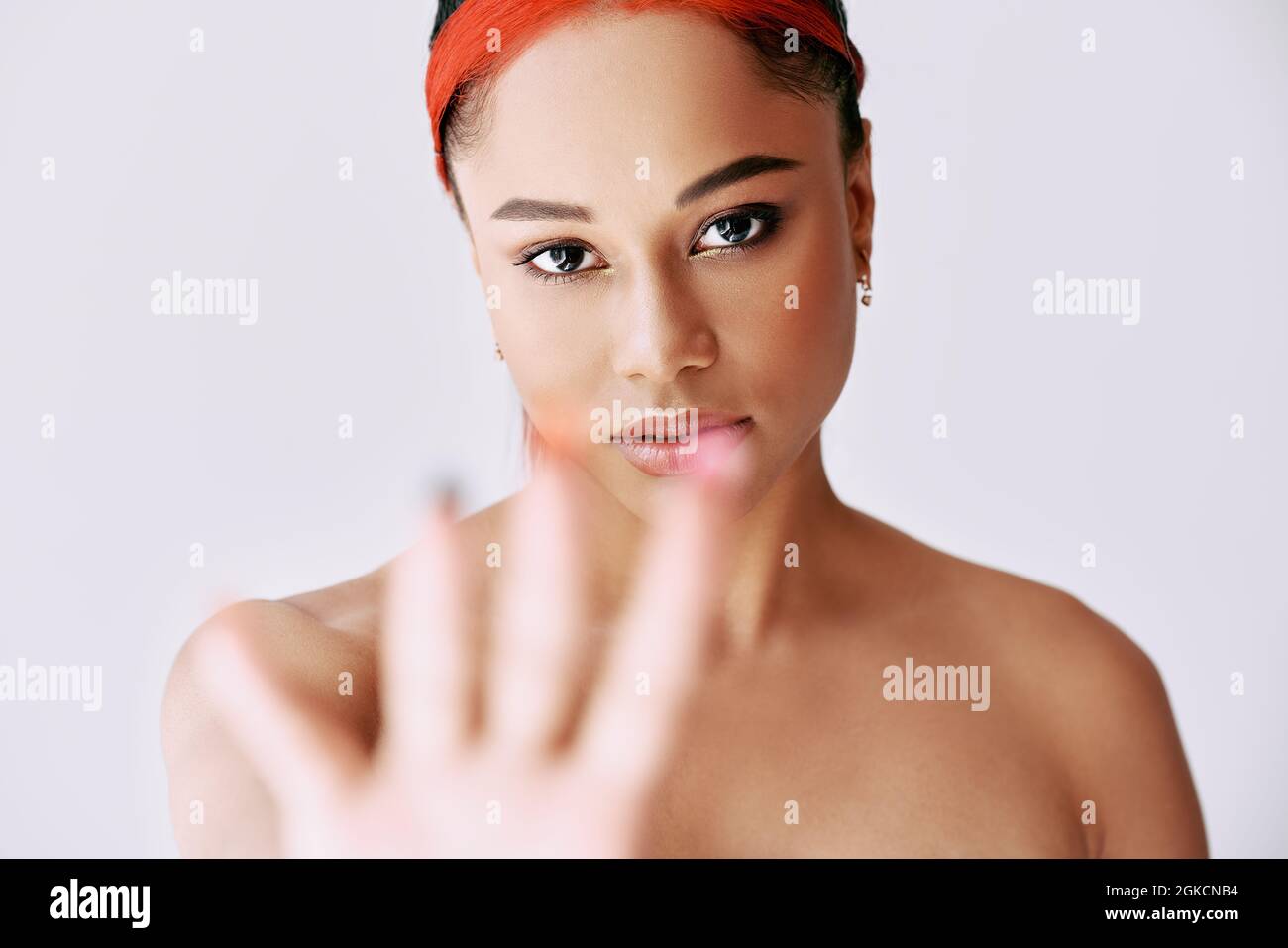 Pretty African American Woman Outstretched Hand And Showing Stop Hand
