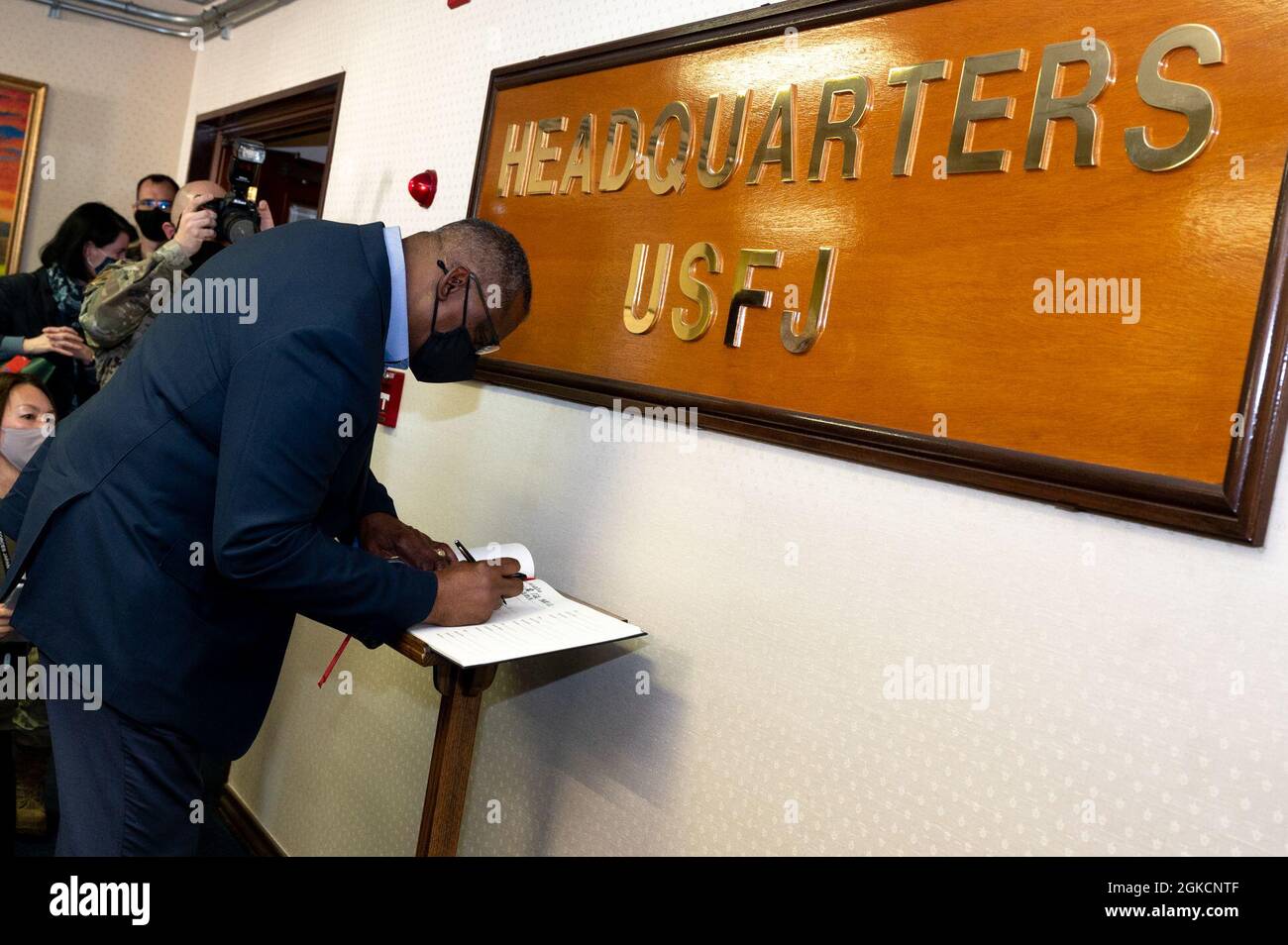 Secretary of Defense Lloyd J. Austin III signs the guest book at the ...