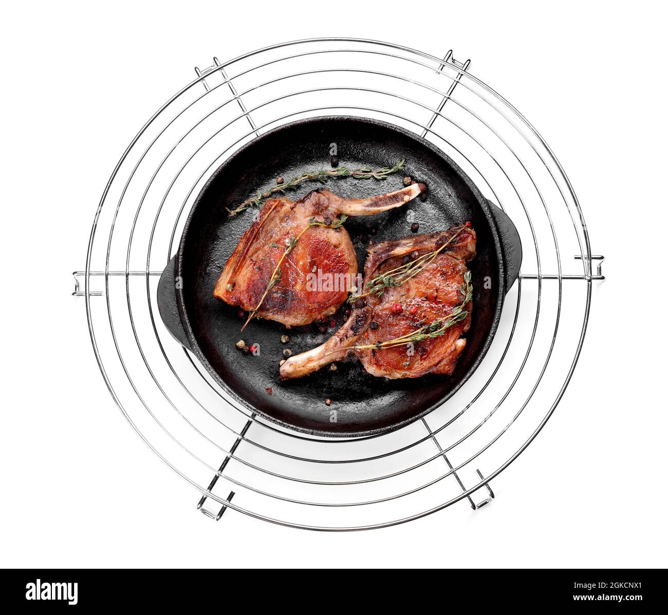 Frying pan with grilled meat on white background Stock Photo - Alamy