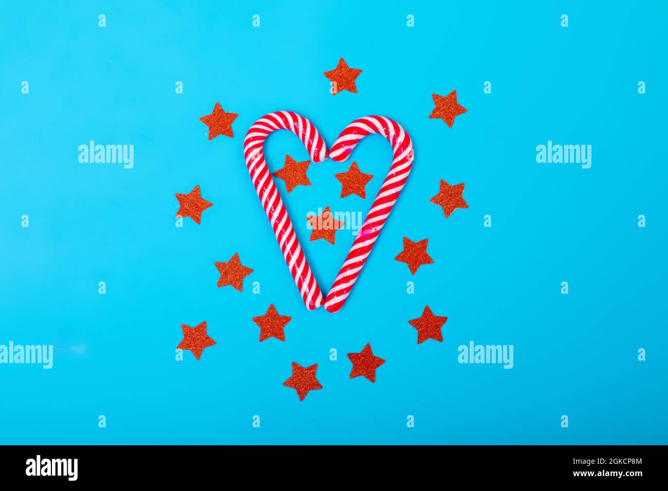 Composition of candy canes with red stars on blue background Stock ...