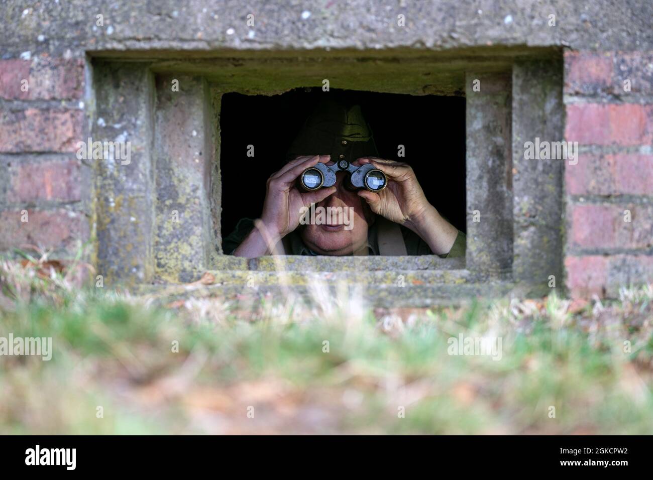 Assistant ranger Rupert Eris dressed in Home Guard uniform looks out ...