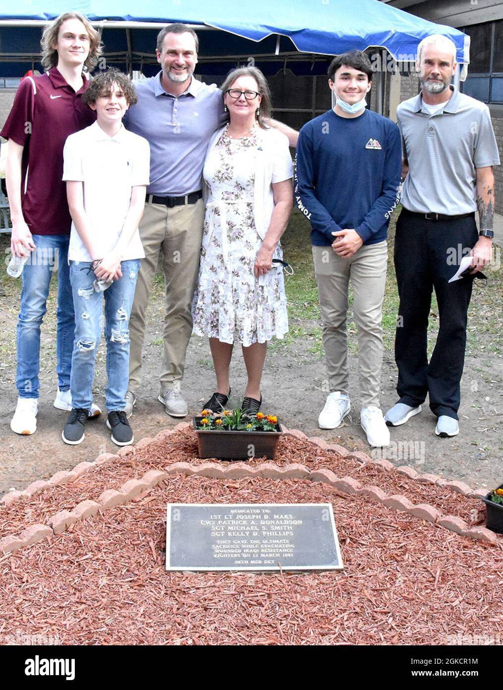 The Maks family stands behind the monument unveiled March 15 as part of ...