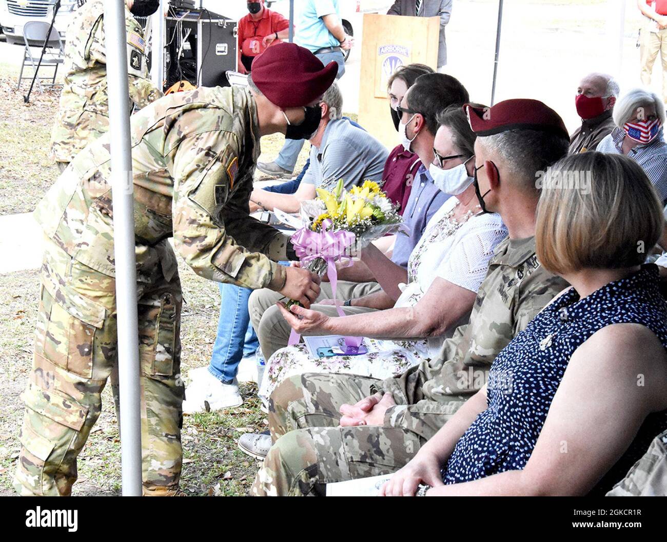 Maj. Ralph Salazar presents flowers to Sue Maks, widow of 1st Lt ...
