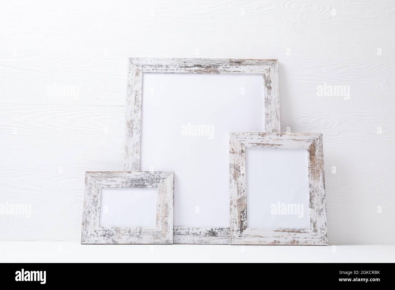 Composition of white cards in distressed white frames with copy space ...