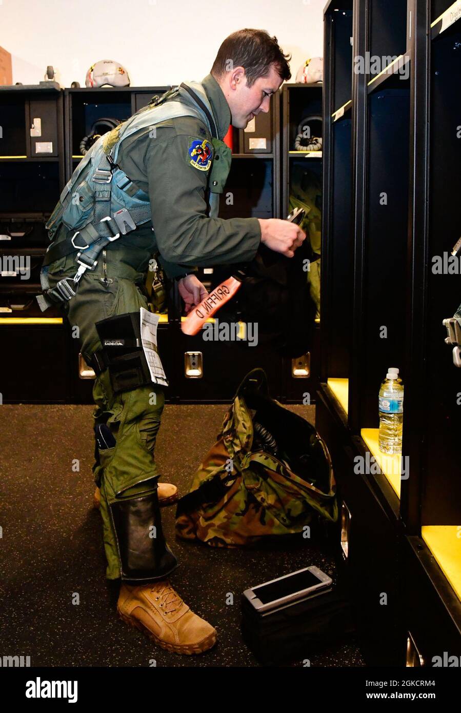Lt. Col. Daniel Griffin, 104th Fighter Squadron, suits up before an A ...