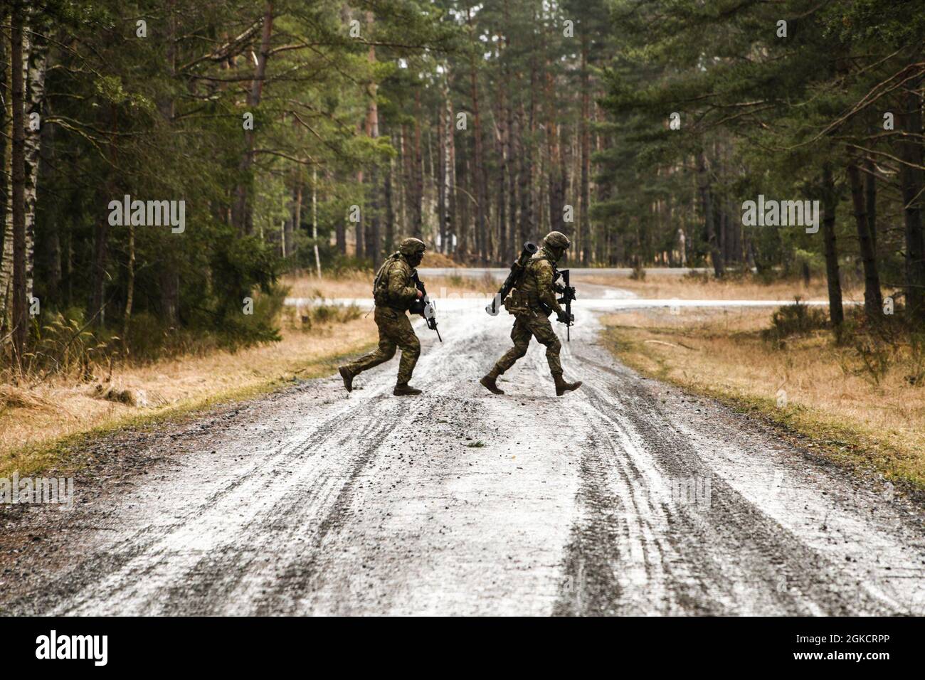 U.S. Soldiers assigned to 3rd Squadron, 2nd Cavalry Regiment cross a ...