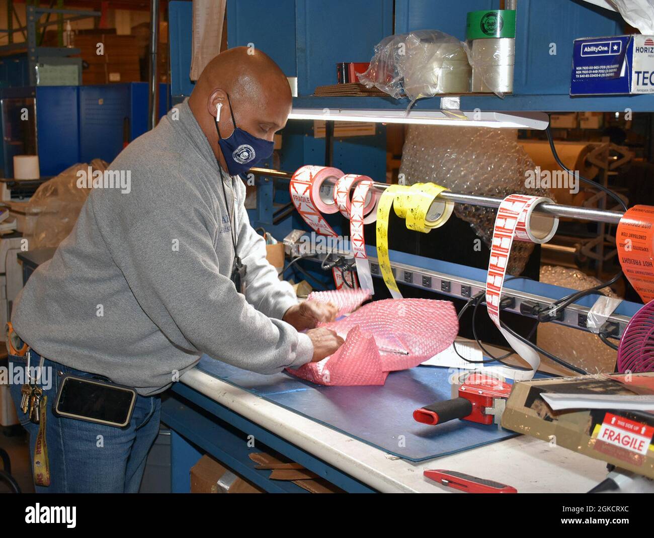 Henry Hunter uses bubble wrap as cushioning for a depot level ...