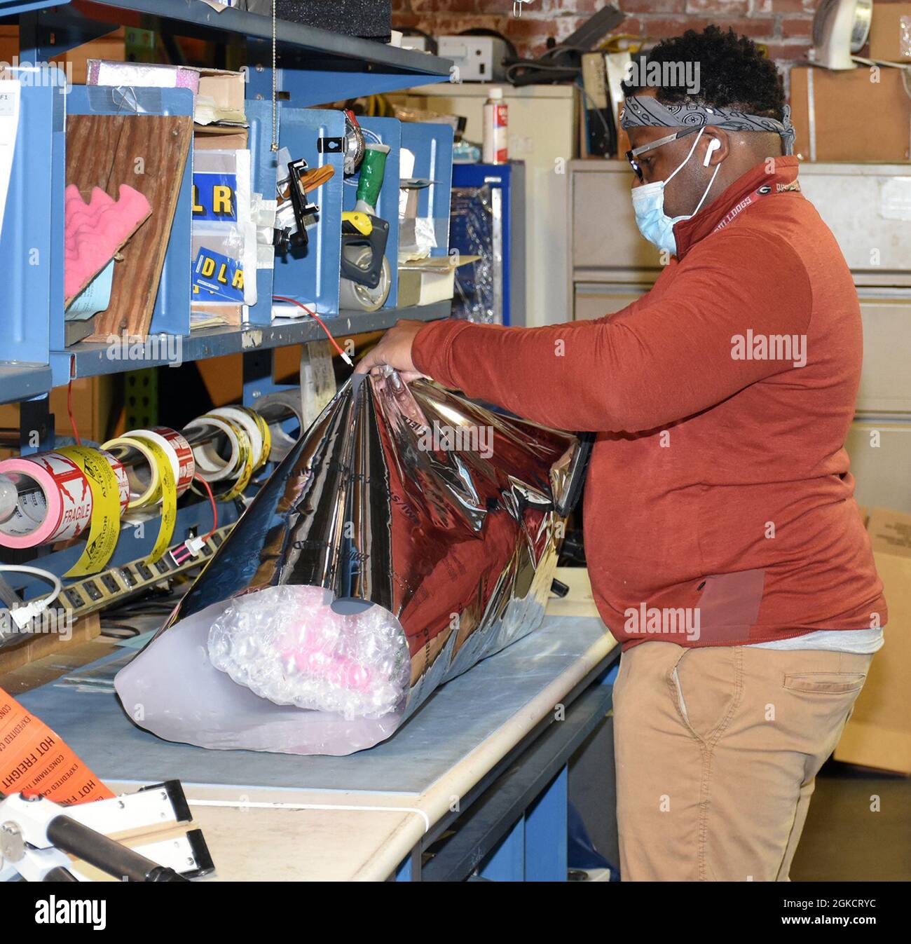Brandon English prepares a depot level repairable item for a sealing ...