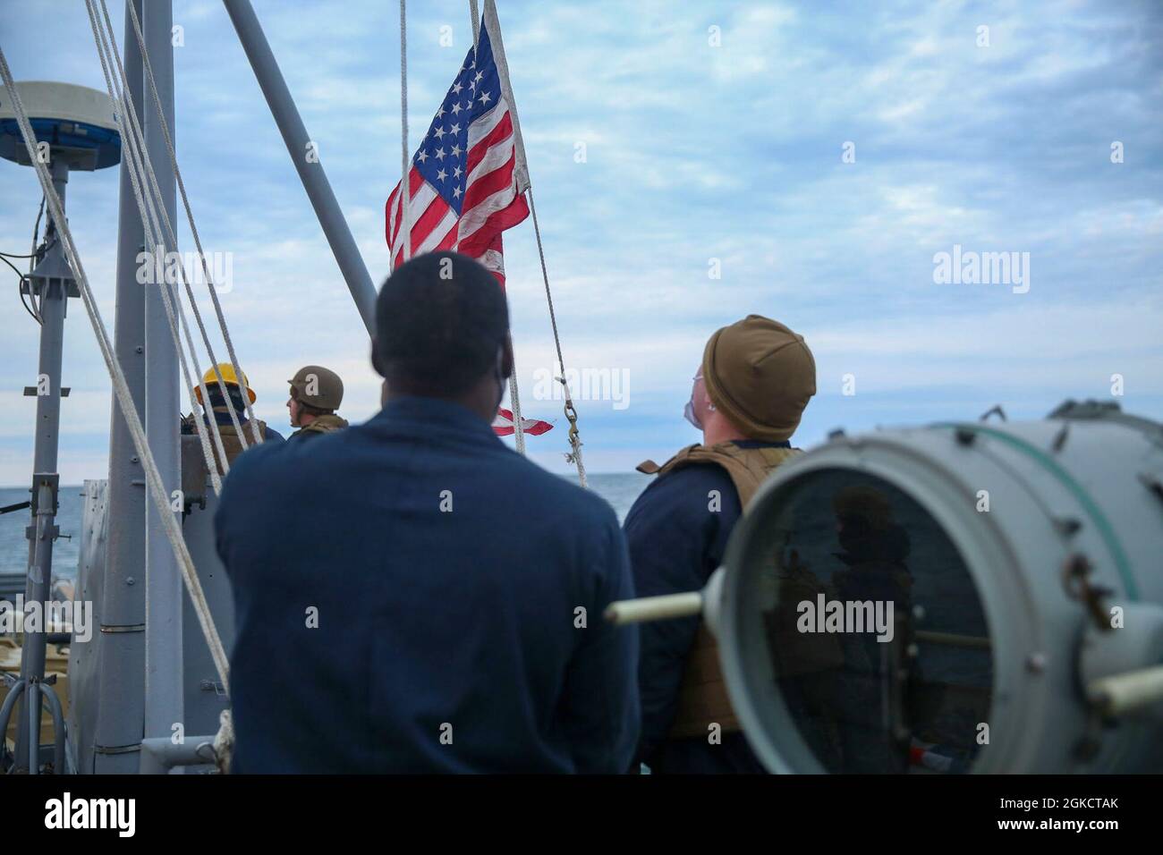 Sailors with Assault Craft Unit 2 raise the colors before landing on ...