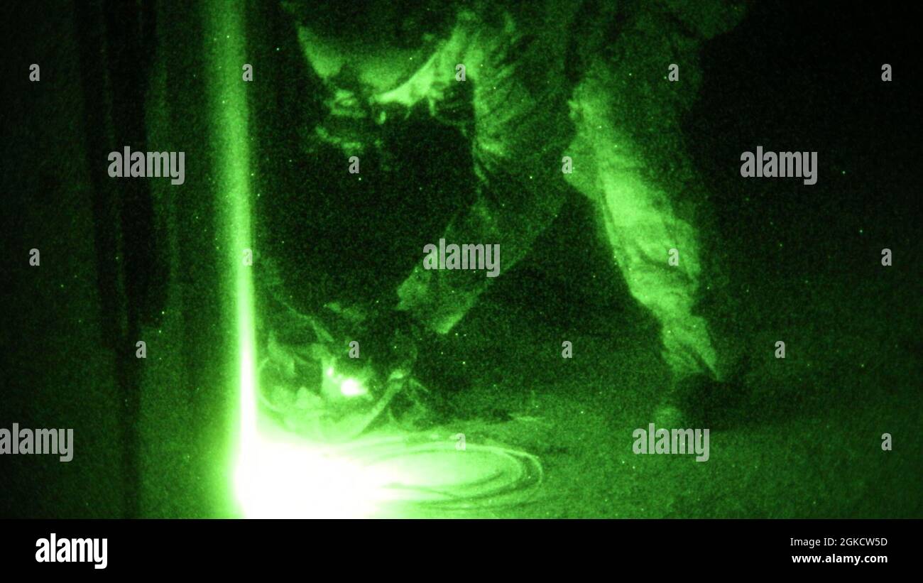 A U.S. Army EOD Technician from 53rd Ordnance Company (EOD) inspects ...