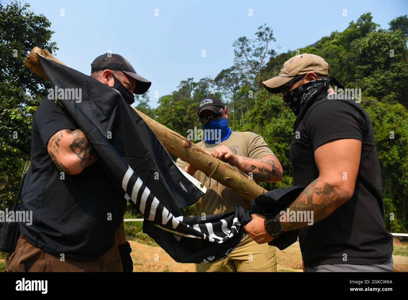 Members of a Defense POW/MIA Accounting Agency (DPAA) recovery team ...