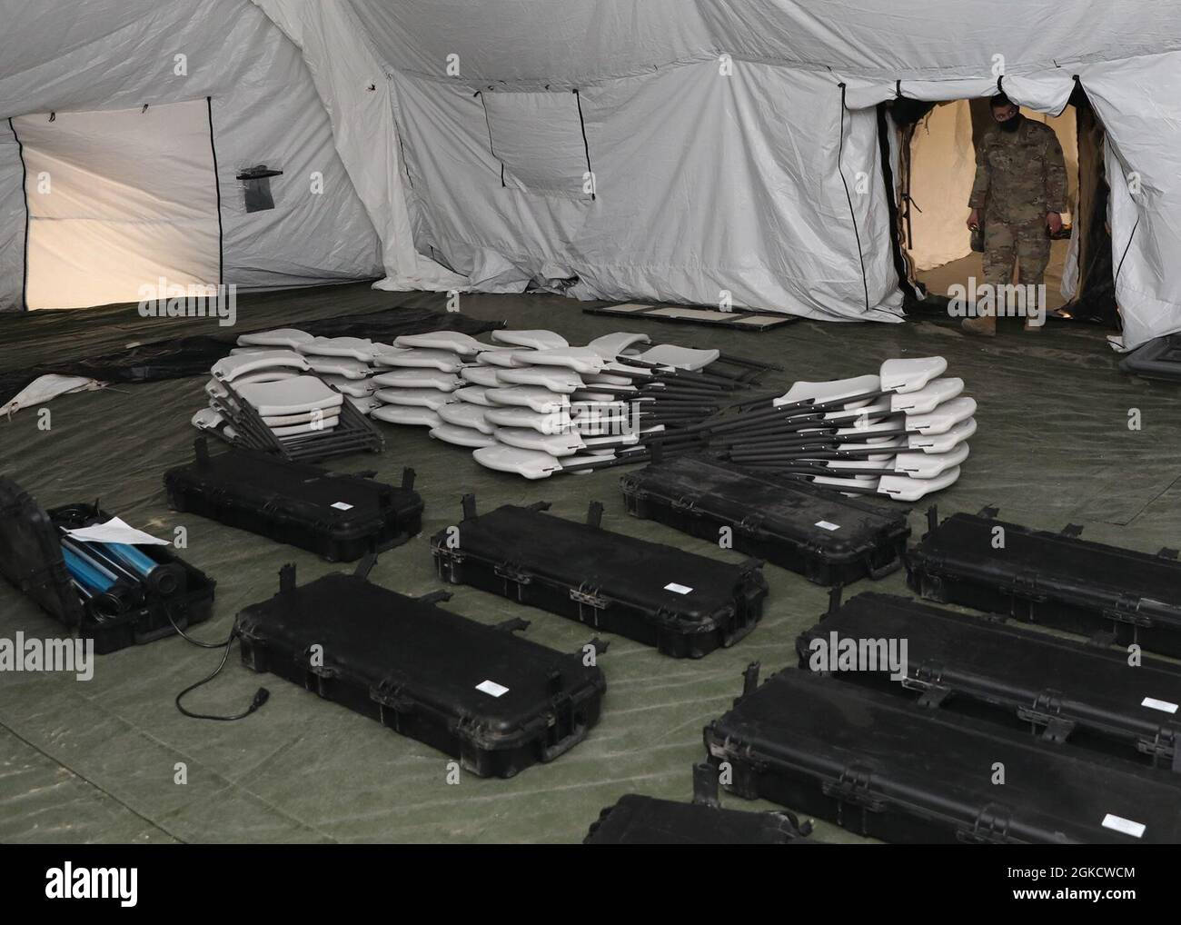 Equipment and furniture is staged for set up at the 310th Sustainment ...