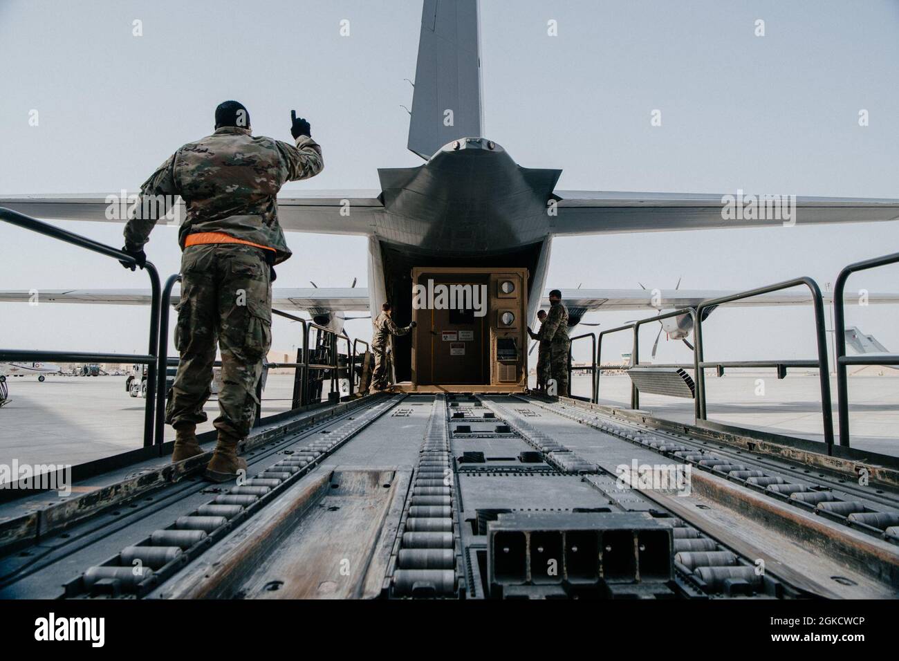 U.S. Air Force ramp service specialists with the 8th Expeditionary Air ...