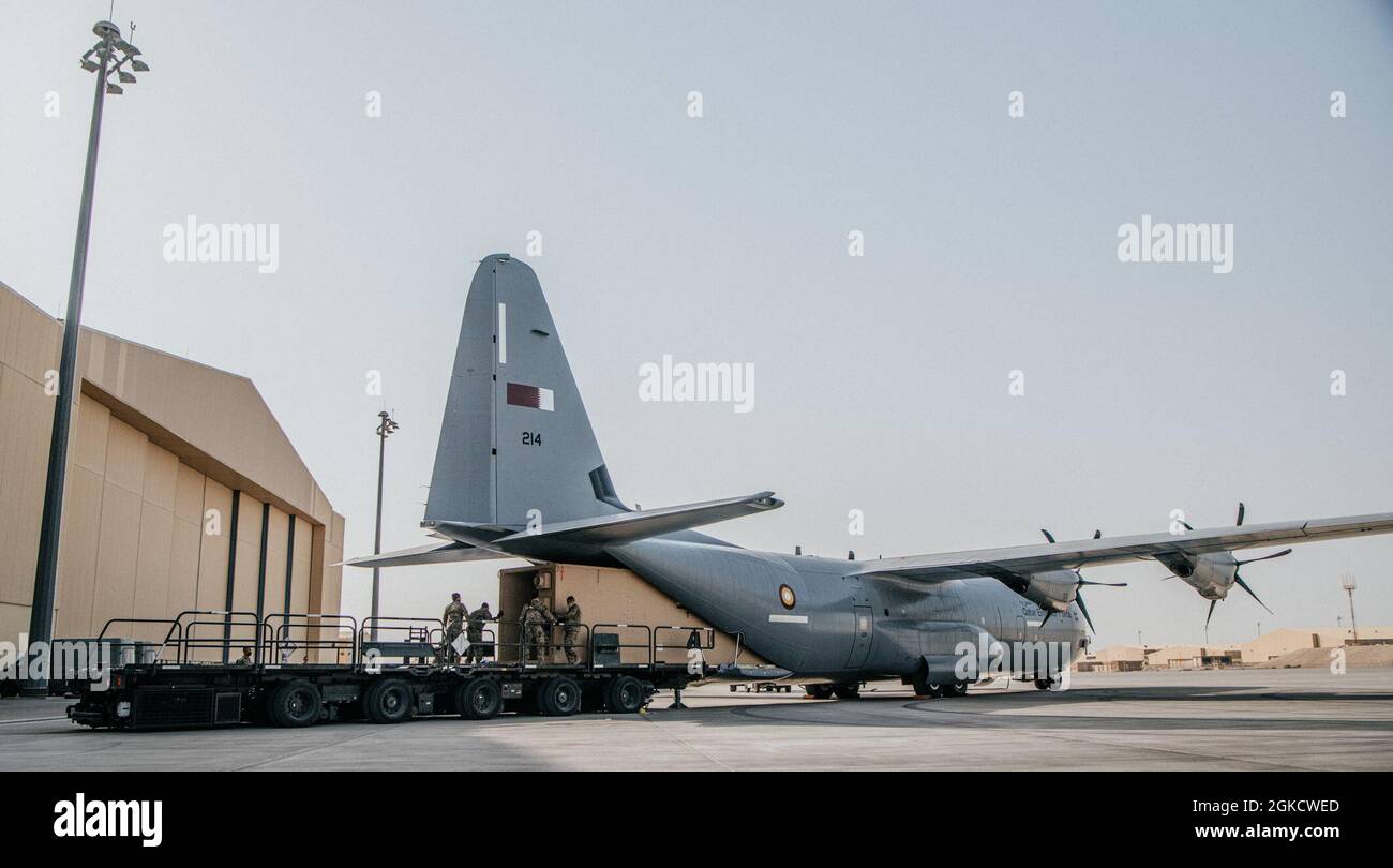 U.S. Air Force ramp service specialists with the 8th Expeditionary Air ...