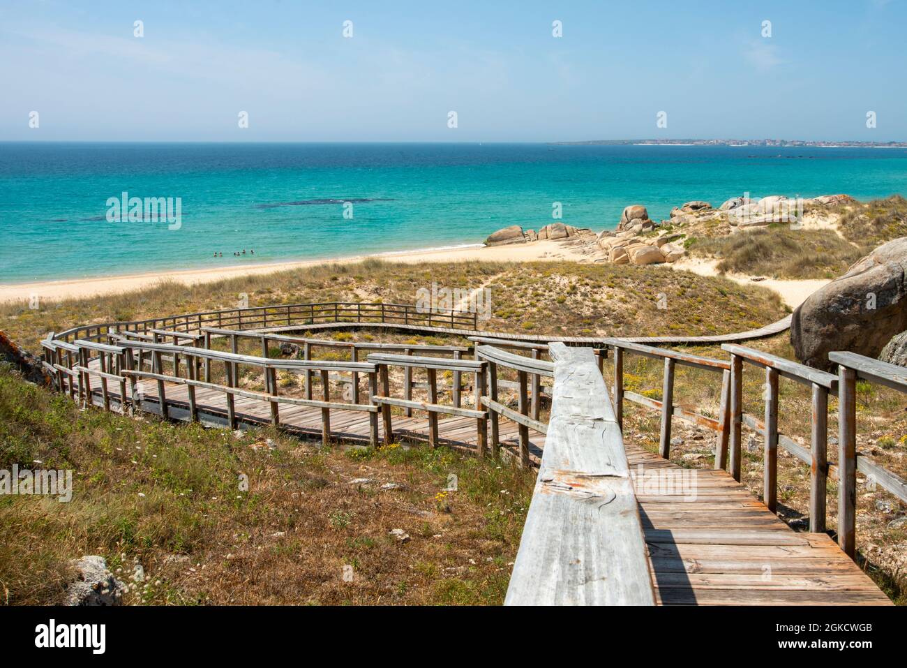 Wooden railing to access a beach near Betanzos in Galicia in Spain and ...
