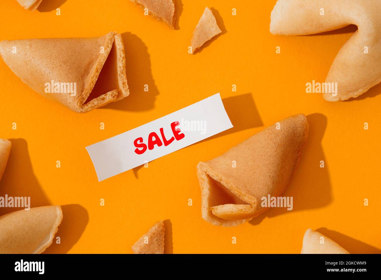 Creative composition with fortune cookies and paper with text on orange ...