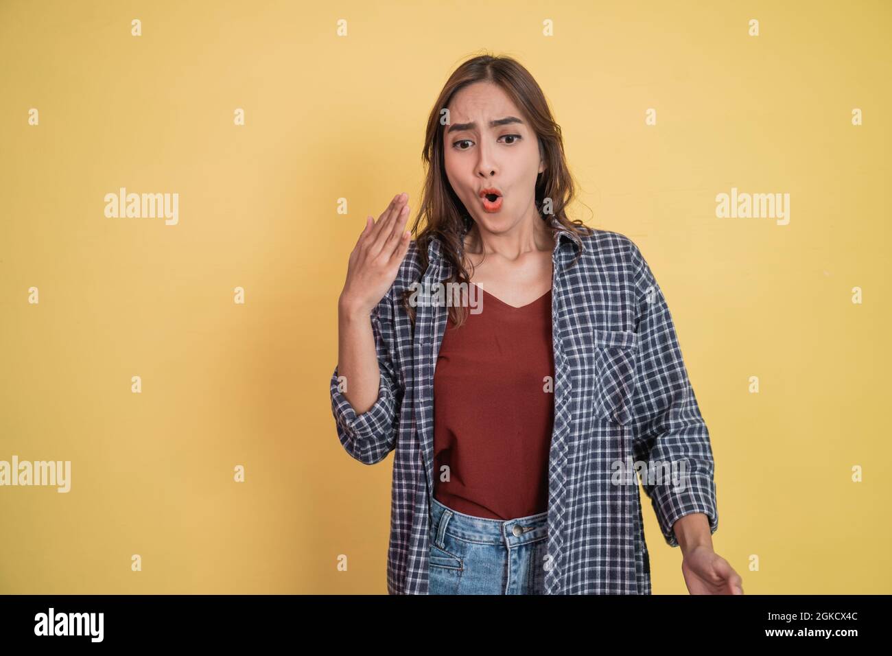 a beautiful woman with waving hand gesture when spiciness with ...