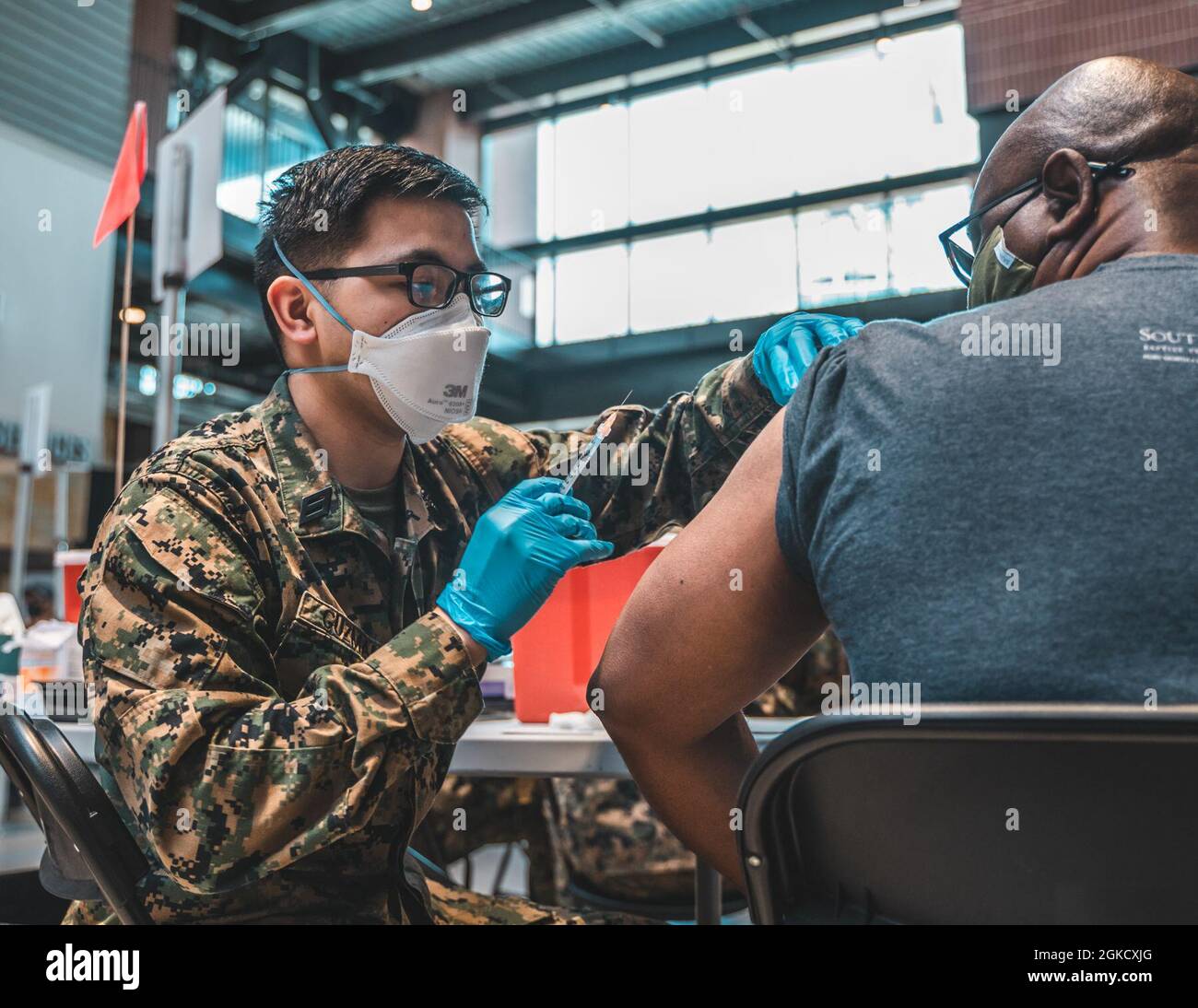 U.S. Navy Seaman Patrick Guzman, a hospitalman with 1st Marine ...