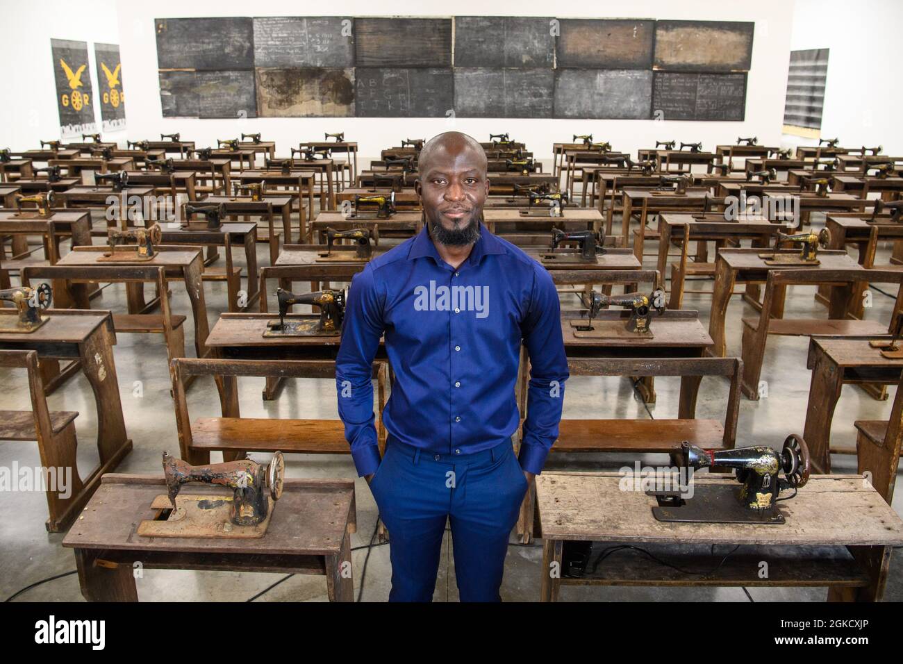 London, UK. 14 September 2021. Ibrahim Mahama pictured with his artwork ...