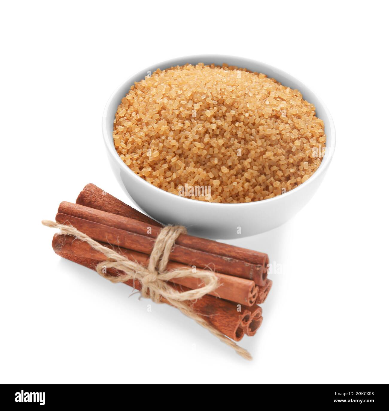 Sweet cinnamon sugar in bowl on white background Stock Photo - Alamy