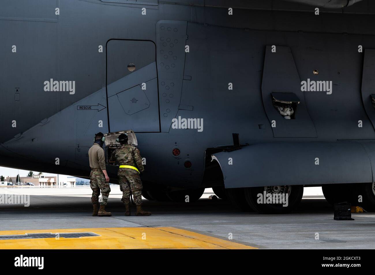 Airmen assigned to the 911th Aircraft Maintenance Squadron look at the ...