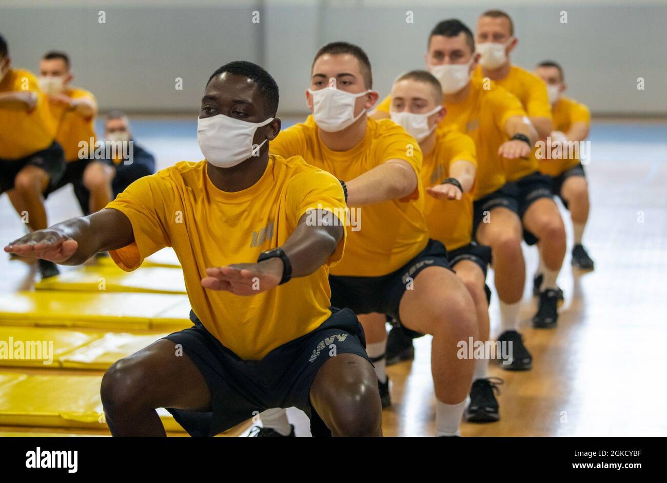 Recruits perform a warm-up exercise before their final physical fitness ...