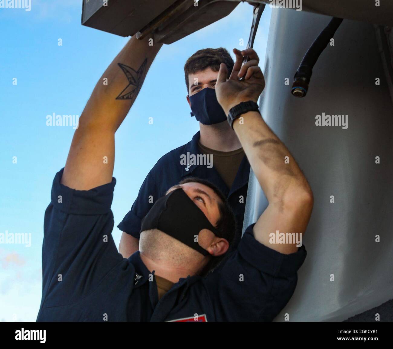 Fire Controlman 1st Class Michael Fraine, from Cheyenne, Wyo., conducts ...