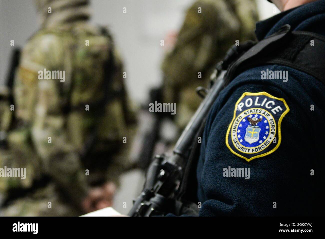 Airmen from the 88th Security Forces Squadron line up in formation for ...