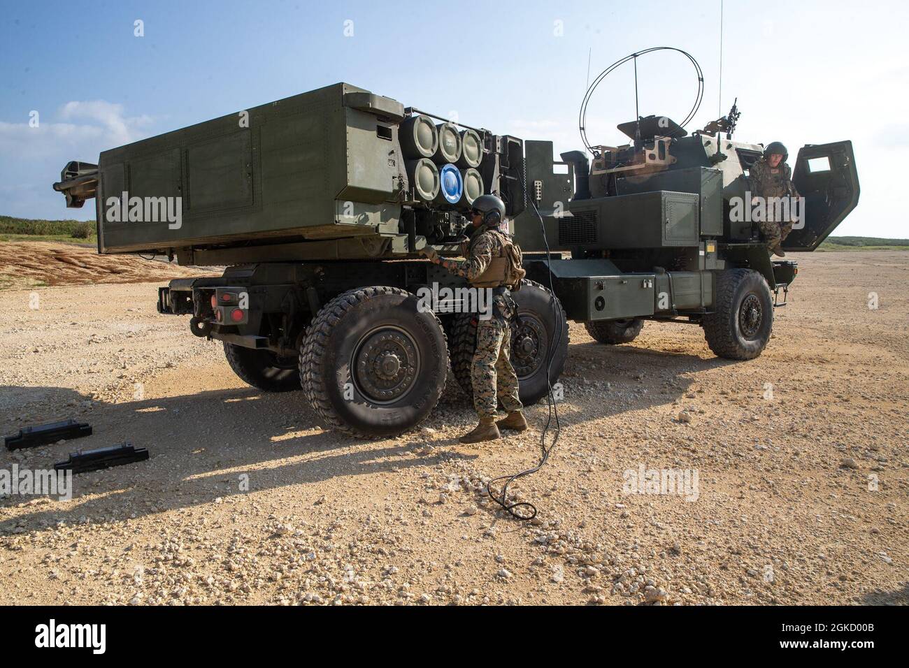 U.S. Marine Corps Cpl. Marqus Hunt (left), a High Mobility Artillery ...