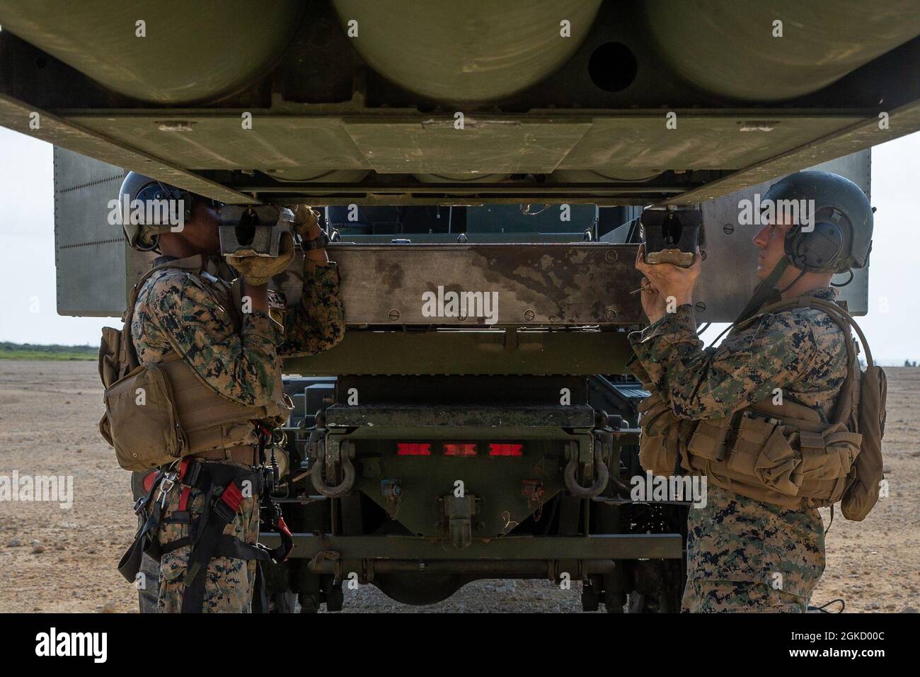 U.S. Marine Corps Cpl. Marqus Hunt (left), a High Mobility Artillery ...